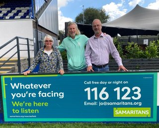 New Samaritans banner at Macclesfield F.C.